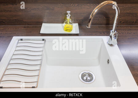 Front view of silver tap and white sink in a clean bathroom Stock Photo ...