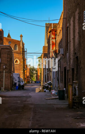 dirty back alley street in the city centre alley behind bars and night ...