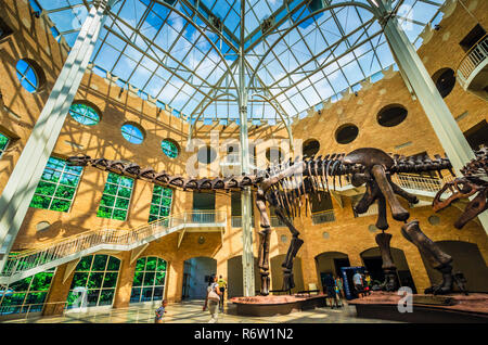 Visitors walk past the Great Hall of the People on Tiananmen Square in ...