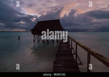 Overwater thatched roof bungalow hut of Micronesian people, lagoon of ...