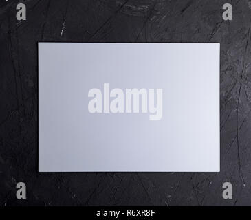 blank white rectangular sheet of paper and crumpled pieces of paper on ...