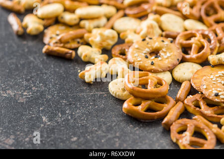 Mixed salty snack crackers and pretzels Stock Photo - Alamy