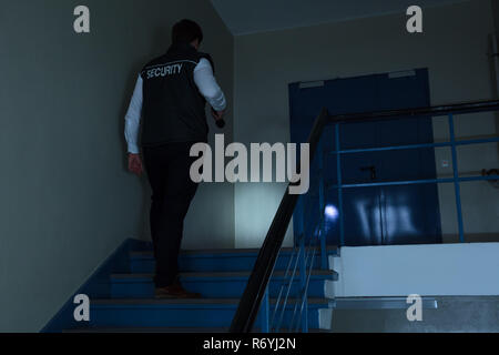 Security Guard Walking On Stairway Stock Photo - Alamy