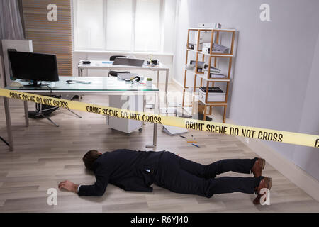 Dead businessman at this desk Stock Photo: 181616158 - Alamy