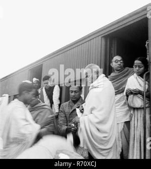 Mohandas Karamchand Gandhi collecting funds for Harijans at a railway ...