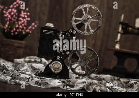 Small nostalgic decorative film camera on brown wooden background Stock ...