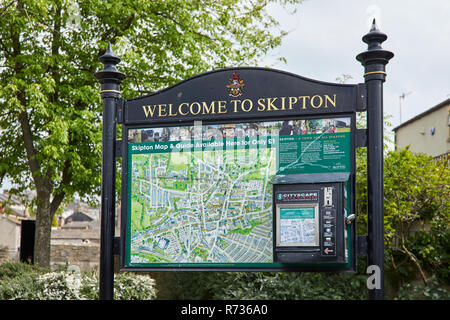 A welcome to Skipton sign with a town map Stock Photo - Alamy
