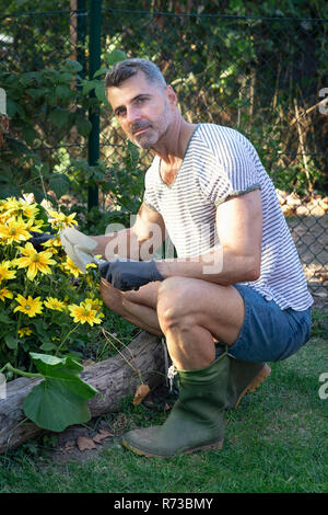 Man with a trowel Stock Photo - Alamy