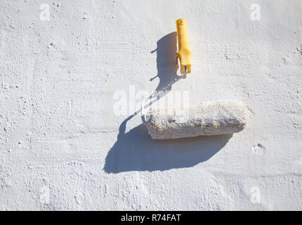 whitewashed exterior wall with paintroller simple rustic background ...
