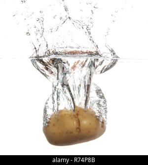 Potato splashing and sinking underwater. White beackgroung Stock Photo ...