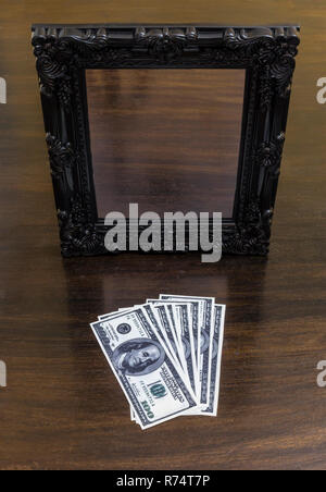 Money without reflection in front of a mirror. Both objects are ...