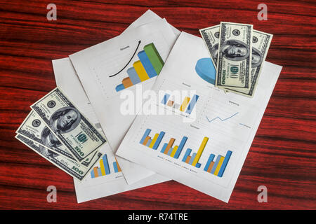 Bunch of printed charts and graphs with dollar bills on them Stock ...