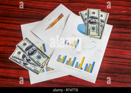Bunch of printed charts and graphs with dollar bills on them Stock ...