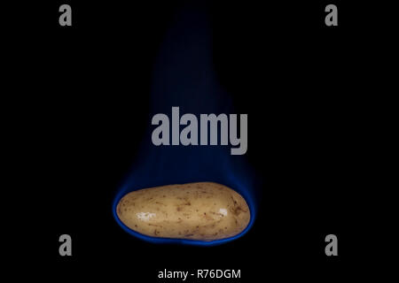 hot potato, potato on fire with flames Stock Photo - Alamy