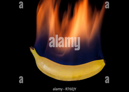 Banana on fire with blue flames isolated on black background Stock ...