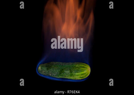 Cucumber on fire with blue flames isolated on black background Stock ...