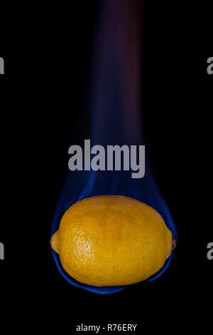 Lemon ot fire with blue flames isolated on black background Stock Photo ...