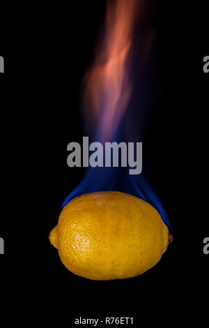 Lemon ot fire with blue flames isolated on black background Stock Photo ...