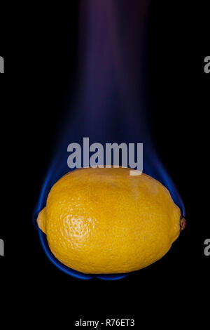 Lemon ot fire with blue flames isolated on black background Stock Photo ...
