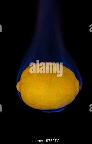 Lemon ot fire with blue flames isolated on black background Stock Photo ...