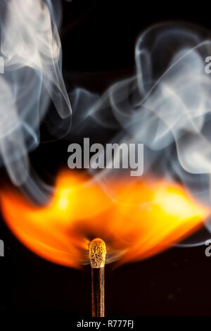 Match just ignited, flame at the match head Stock Photo - Alamy