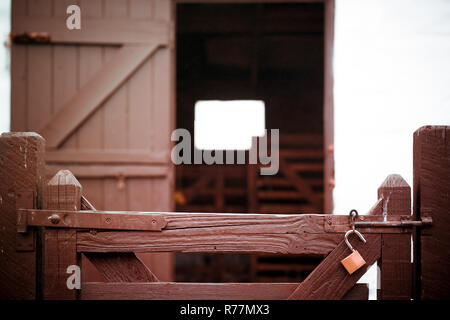 Wooden gates with unlocked padlock Stock Photo - Alamy