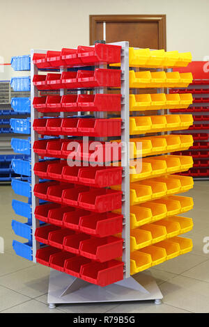 Inventory cart with plastic red boxes for warehouse Stock Photo - Alamy