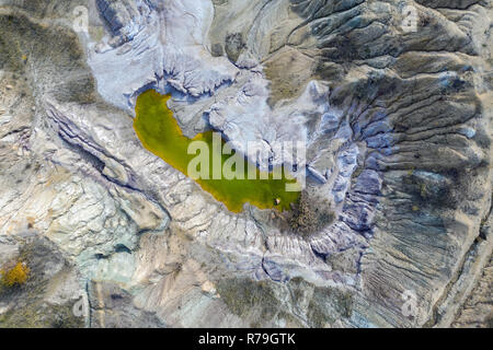 Abandoned industrial mining area. Drone view of opencast mine filled ...