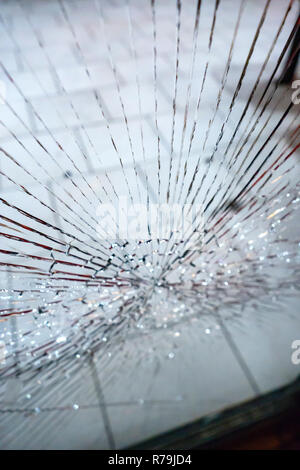 Broken shop window with color background Stock Photo - Alamy