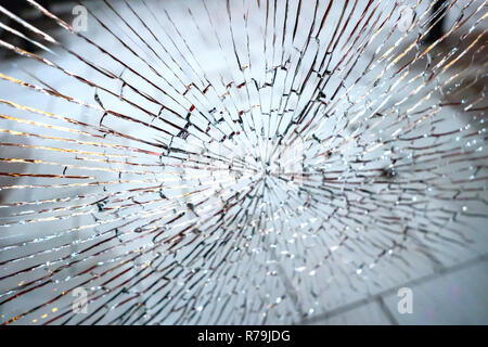 Broken shop window with color background Stock Photo - Alamy