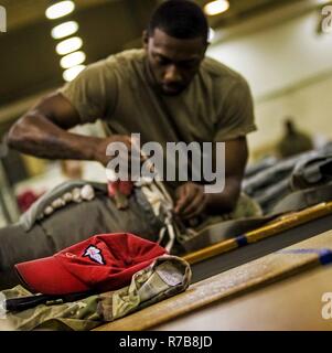 Parachute Riggers wear the Red Hat signifying that they are experts ...