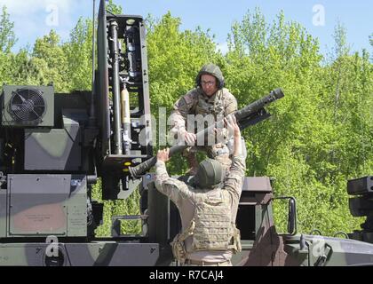 A soldier from Btry. A, 2nd Bn., 6th Air Defense Artillery Bde., sits ...