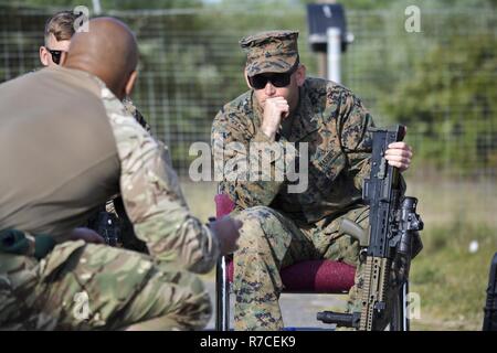 Royal Marine Commando Sgt. Chris Abrams supervises the conduct of the ...