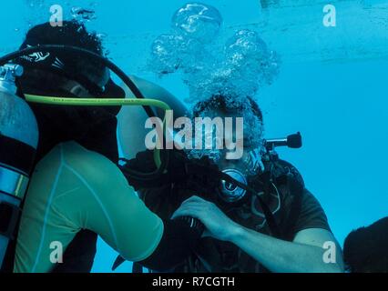 Cpl. Kaleb Kinker, right, fights through interference by an instructor ...