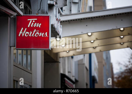 MONTREAL, CANADA - NOVEMBER 5, 2018: Tim Hortons logo in front of one ...