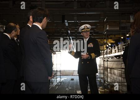 SASEBO, Japan (Dec. 5, 2018) Capt. Colby Howard (center), commanding ...