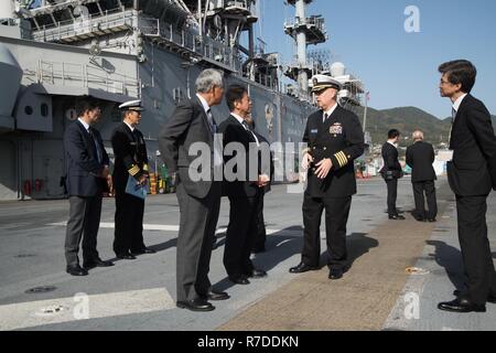 SASEBO, Japan (Dec. 5, 2018) Capt. Colby Howard (center), commanding ...
