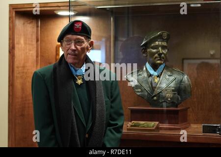 Retired Army Col. Roger H. C. Donlon, right, kisses his wife, Norma, at ...