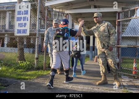 Guam Army National Guardsmen Pfc. Ryan Jimmy and Spc. Tristan Cruz ...