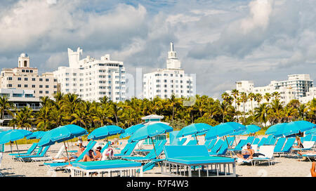 People on miami beach on sunny day Stock Photo - Alamy