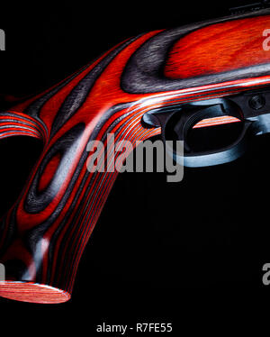 Red laminated wood rifle stock with a thumb hole Stock Photo - Alamy