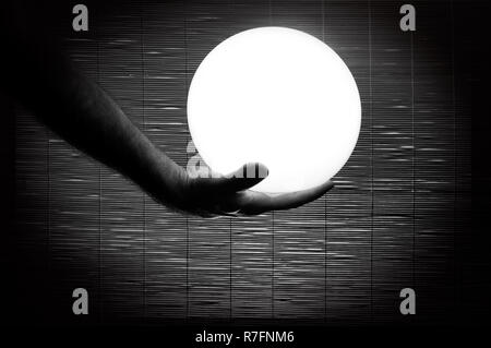 light magical sphere in human hand in the night Stock Photo - Alamy