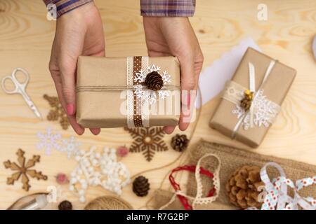 scrapbook background. christmas - girl packs gift Stock Photo - Alamy