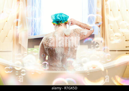 Fat ugly man washing in a bath. Bizarre male person laughing in ...