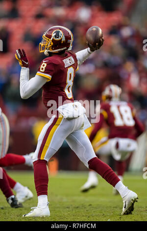 Washington Redskins quarterback Josh Johnson (8) tries to get away from ...