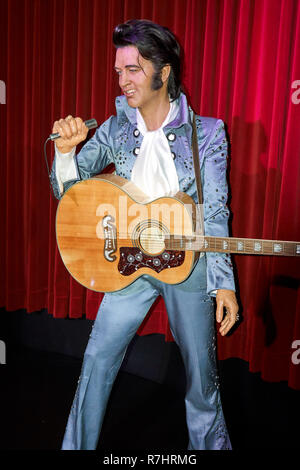 A wax figure of Elvis Presley, American singer and actor on display at ...