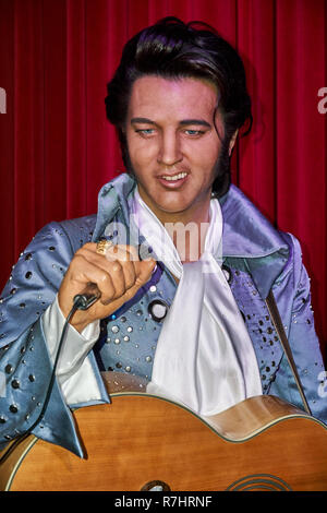 A wax figure of Elvis Presley, American singer and actor on display at ...