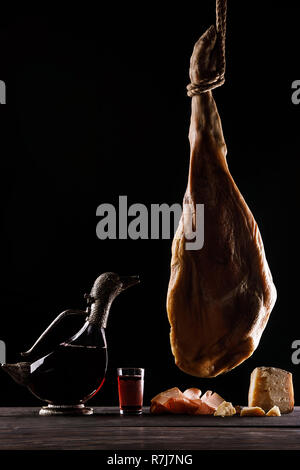 Traditional raw gourmet duck leg offered with herbs as close-up on a ...