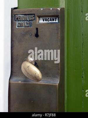 Antique brass public toilet door lock Stock Photo - Alamy