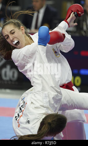 Women karate contestants compete in the elimination round of Kumite by ...